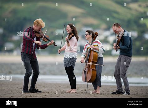 Young Classical Musicians The Solem String Quartet Playing Their Instruments Outdoors On The