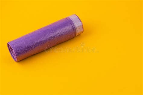 Bright Purple Plastic Roll On Vibrant Yellow Background Stock Image Image Of Plastic