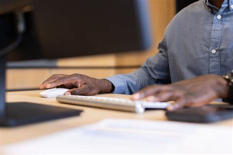 Using Computer Mouse And Keyboard Person Working In Modern Office Environment Stock Image