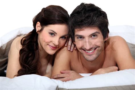 Portrait Of A Young Couple In Bed Stock Image Colourbox