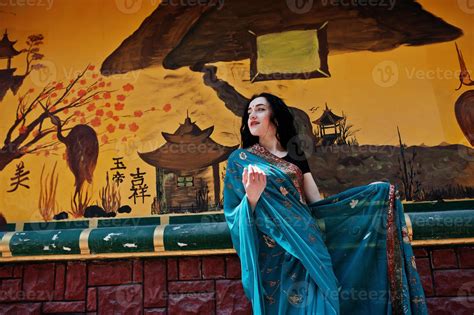 Portrait Of Beautiful Indian Brumette Girl Or Hindu Woman Model Against