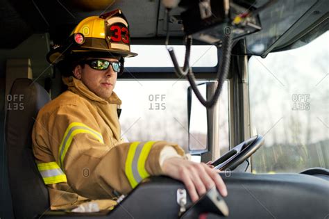 A Fireman In The Drivers Seat Of A Fire Engine Stock Image Everypixel