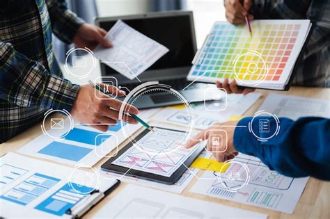 Premium Photo Ux Developer And Ui Designer Brainstorming About Mobile App Interface Wireframe