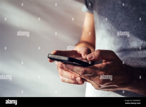 Man Using Modern Smartphone Portable Information Device To Type Text