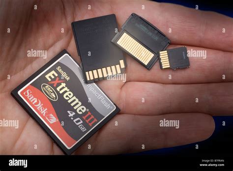 Flash Memory Types Compared From Korea Taiwan Japan Held In A Hand To Show Small Sizes Stock