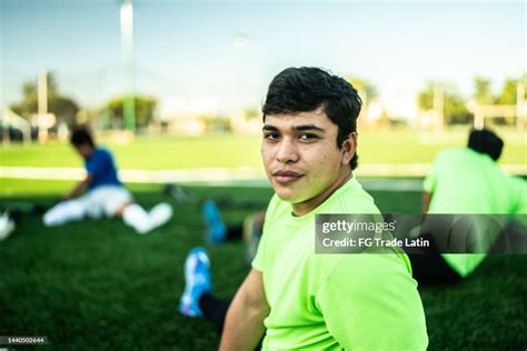 Portrait Of A Young Amputee Soccer Player On Soccer Field High Res
