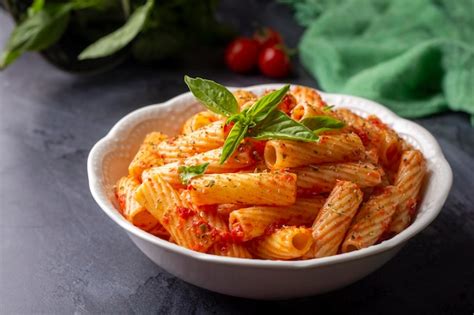 Premium Photo Penne Pasta With Tomato Sauce