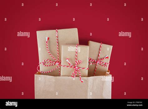 Christmas T Boxes Wrapped In Craft Paper With Striped Red And White