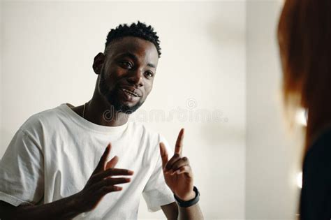 Smiling Man Engaging In Conversation With Friend Stock Image Image Of