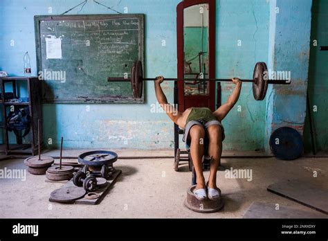 A Cuban Man Does Exercise At A Bodybuilding Gym In San Rafael Street A Cuban Man Does Exercise At A Bodybuilding Gym In San Rafael Street