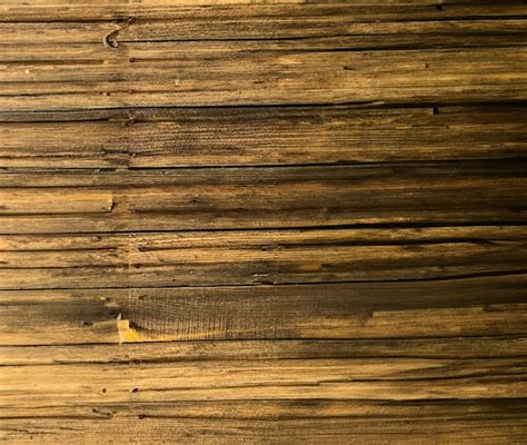Un fondo de pared de madera con un telón de fondo de valla con tablones