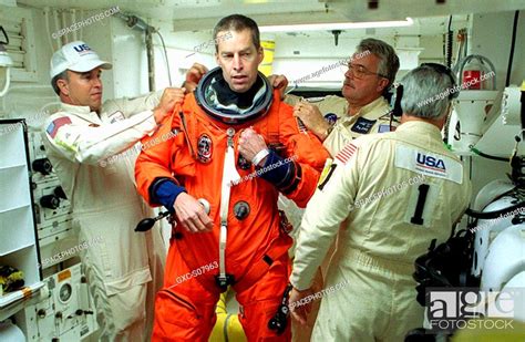 03082001 In The White Room Launch Pad 39b Sts 102 Commander James Wetherbee Gets Help