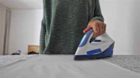 Young Woman Demonstrates To Properly Iron Stock Footage Sbv 348922120