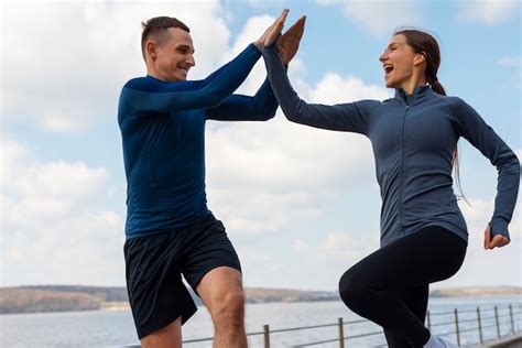 Free Photo Low Angle Couple Doing Workout Exercises