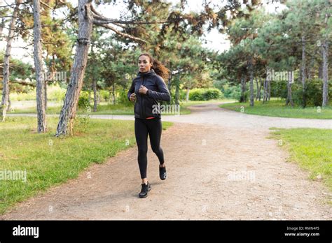 Image Of Young Woman 20s Wearing Black Tracksuit Working Out While