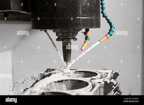 Cnc Milling Machine Grinds Holes In Car Engine With Coolant Process Of
