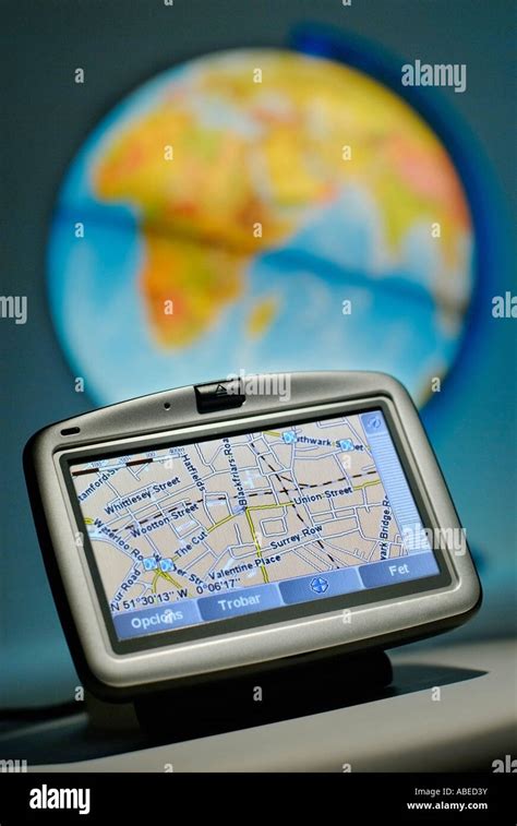 GPS SATELLITE NAVIGATION INSTRUMENT IN FRONT OF GLOBE Stock Photo Alamy