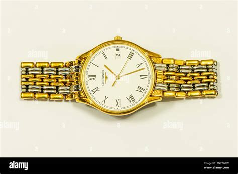 A Longines Lyre Quartz Movement Wristwatch With A Gold Case And A Gold Steel Bracelet Stock