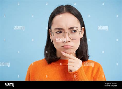 Portrait Of Thoughtful Asian Woman In Glasses Girl In Prescribed