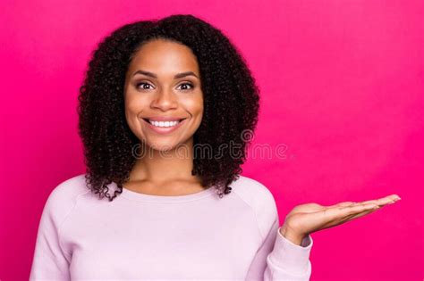 Photo Of Optimistic Young Brunette Lady Hold Empty Space Wear Pink