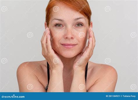 Portrait Of Cropped Caucasian Middle Aged Woman Face With Freckles