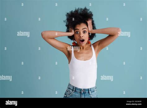 Shocked African American Girl Grabbing Her Head And Looking At Camera