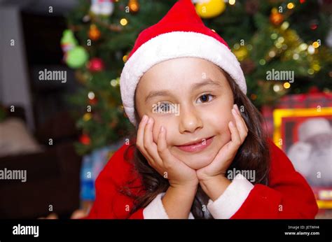 Beautiful Smiling Litle Girl Wearing A Christmas Clothes With A