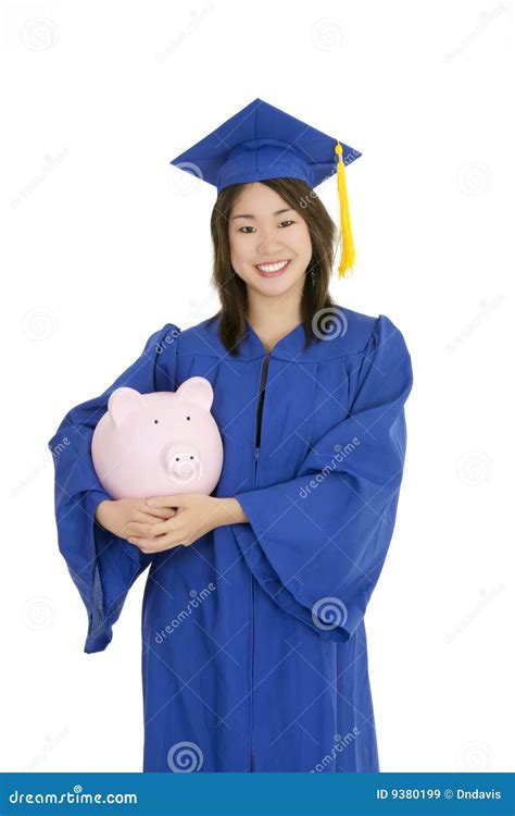 Asian Teenager Wearing Blue Graduation Gown And Holding Piggy Bank