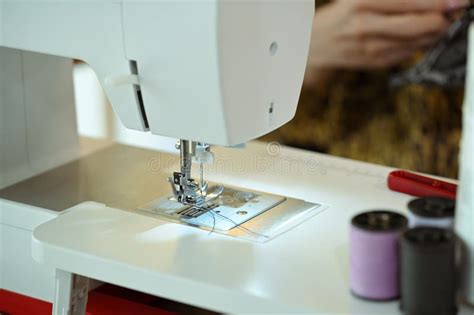 Close Up Of A Sewing Machine With Thread And Fabric At Fashion Designer Workspace Stock Image