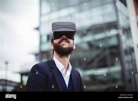 Businessman Using Virtual Reality Headset Stock Photo Alamy