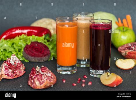 Three Glasses Of Different Fresh Juice Beet Carrot And Apple Juices