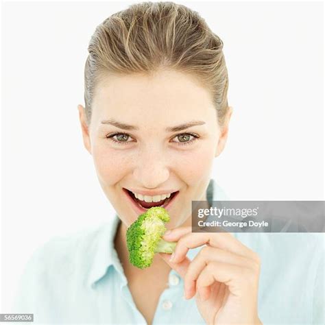 Woman Eating Broccoli Photos And Premium High Res Pictures Getty Images