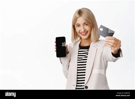 Smiling Business Woman Extending Hand Showing Mobile Phone Screen App