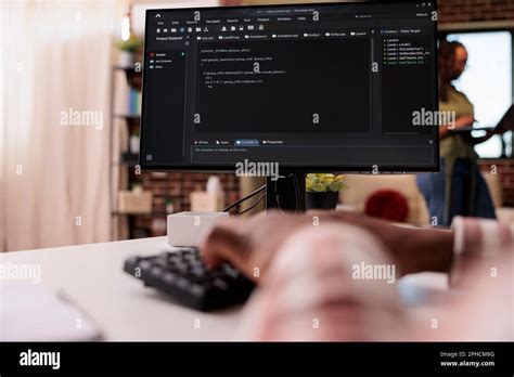Closeup Of African American Programmer Writing Code On Personal
