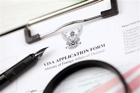 Premium Photo Thailand Visa Application Form On A Tablet Lies On Office Table With Pen And