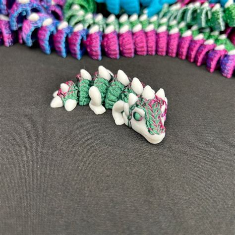 3d Printable Small Knitted Dragon Fidget By Built Over Bot