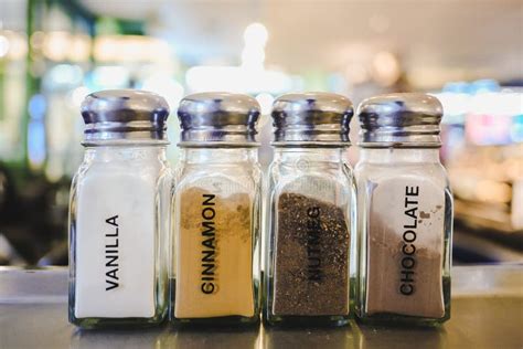 Coffee Additives In The Coffee Shop Including Vanilla Cinnamon Stock