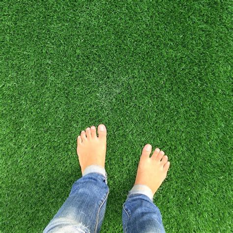 Premium Photo Low Section Of Person Standing On Grass