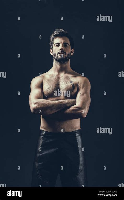 Portrait Of A Shirtless Man With Arms Crossed Stock Photo Alamy