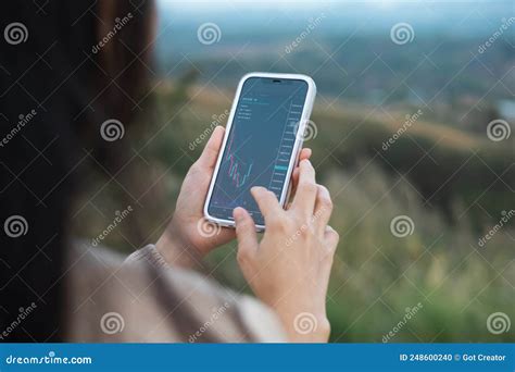 Woman Is Checking Bitcoin Price Chart On Digital Exchange On Smartphone