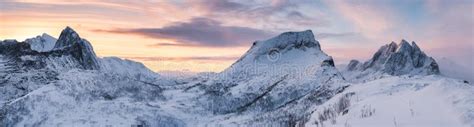 Panorama Of Sunrise Over Snowy Mountain Range With Colorful Sky In