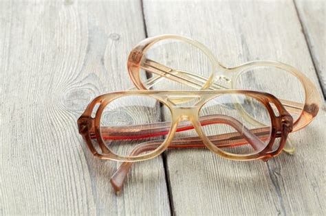 Premium Photo Eyeglasses On Wooden Table