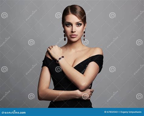 Young Beautiful Womanbeauty Girl In Black Dress And Jewelry Stock