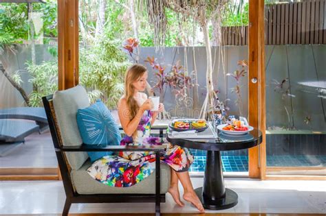 Female Traveler Enjoy Her Tea And Delicious Exotic Food Sitting Near