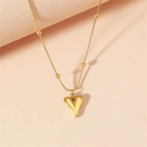 Pointed Heart Necklace Being Jewelled
