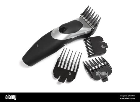 Electric Hair Trimmer And Assorted Plastic Combs On White Background