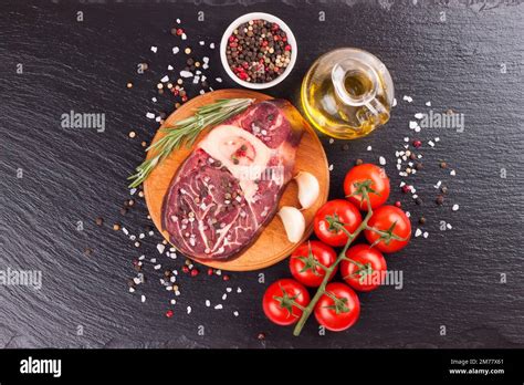 Raw Meat Beef Steak With Bone Spices Rosemary And Cooking Ingredients