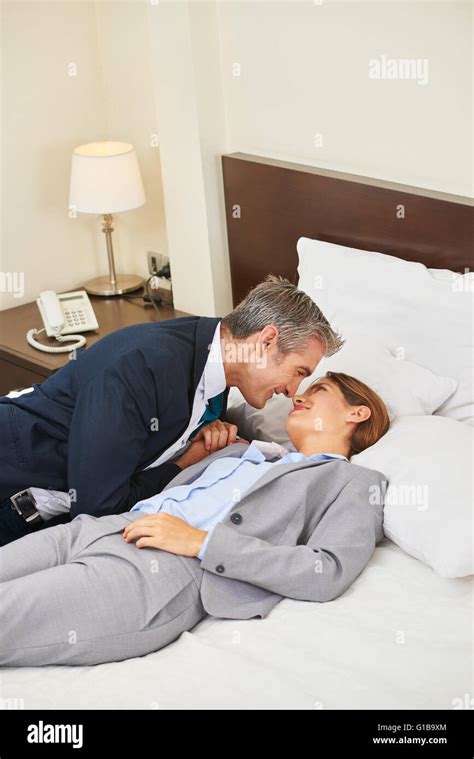 Two Business People Having An Affair In A Hotel Room During Business