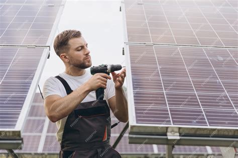Premium Photo Male Bearded Technician Installing Solar Panel Using