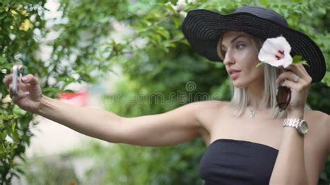 Young Stylish Beautiful Woman In Hat Does Selfie Female Using A Smart